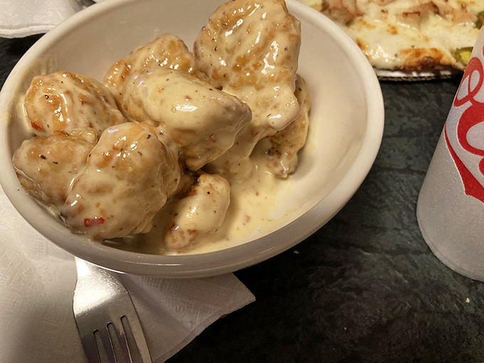 These boneless wings bathed in garlic parmesan sauce aren't just appetizers—they're the supporting actors who could steal the whole show.