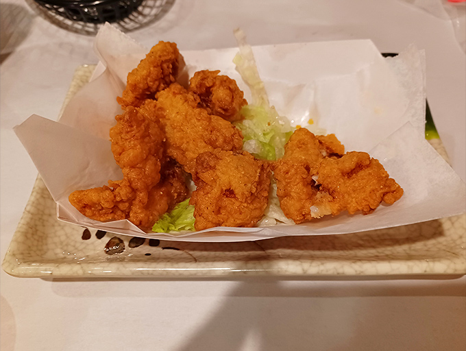 Golden-fried goodness served on a bed of lettuce—crispy on the outside, tender within, and impossible to share.