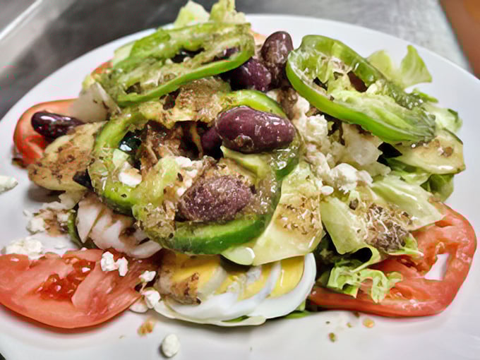 A Greek salad that looks like it just returned from vacation in the Mediterranean—olives, feta, and veggies having their own little party.