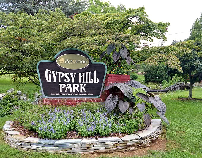 Gypsy Hill Park's entrance sign surrounded by flowers that clearly got the memo about making good first impressions.