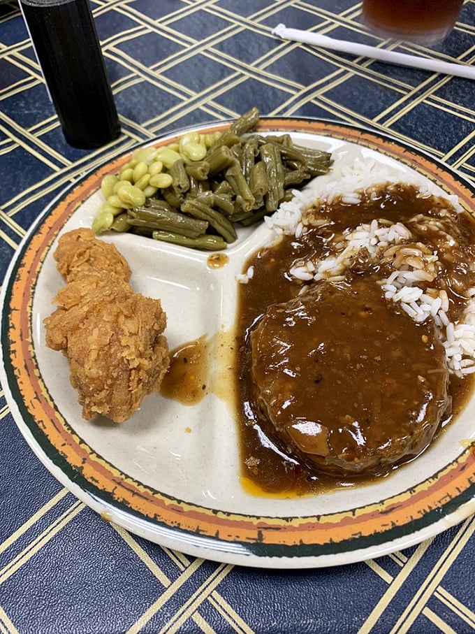 Southern comfort on a plate. That hamburger steak swimming in gravy is what food hugs would look like if they took physical form.