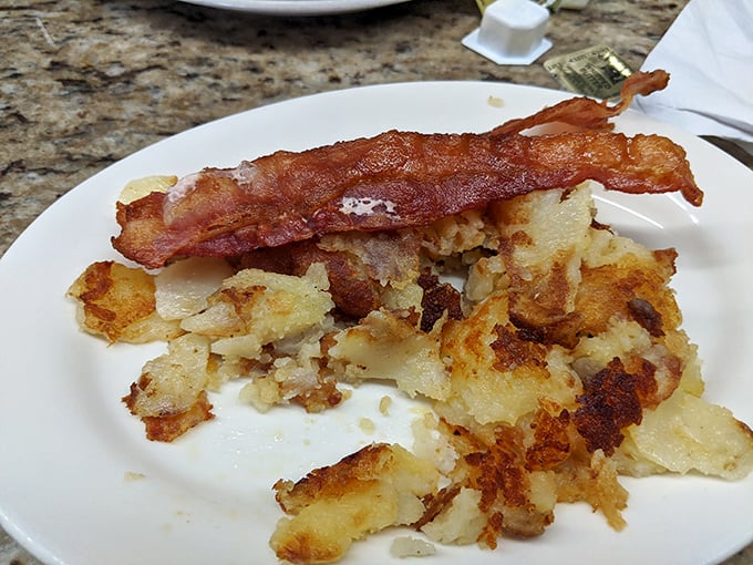 These hash browns with bacon aren't just crispy potatoes—they're the golden foundation of a perfect morning, with edges so crisp they practically sing.