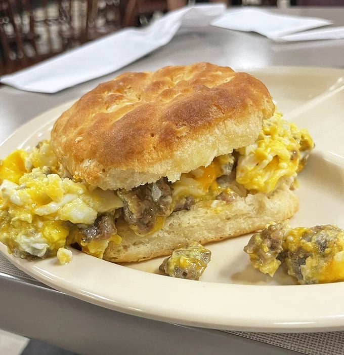 The Hobo Sandwich doesn't apologize for its abundance—sausage and egg spilling out of a biscuit like it's making a jailbreak for your taste buds.