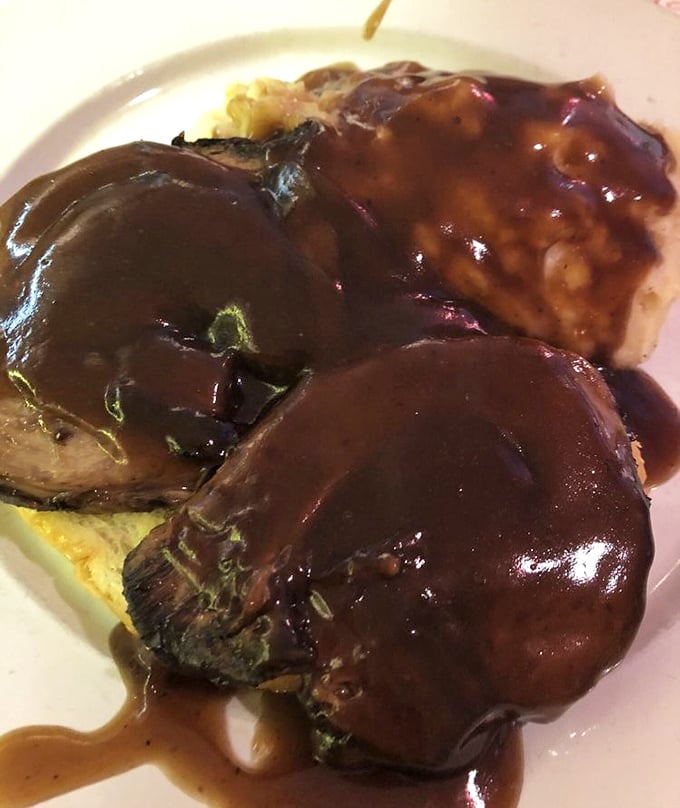 This hot roast beef sandwich isn't just covered in gravy—it's swimming in a pool of happiness that would make synchronized swimmers envious.