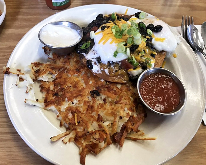 Crispy hash browns, perfectly cooked eggs, and a side of salsa—this plate doesn't need a filter, just your undivided attention.