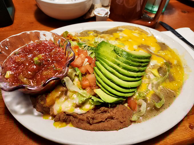 Southwestern breakfast artistry – where avocado fans, salsa enthusiasts, and cheese lovers find common ground in a plate that screams "Buenos días!"