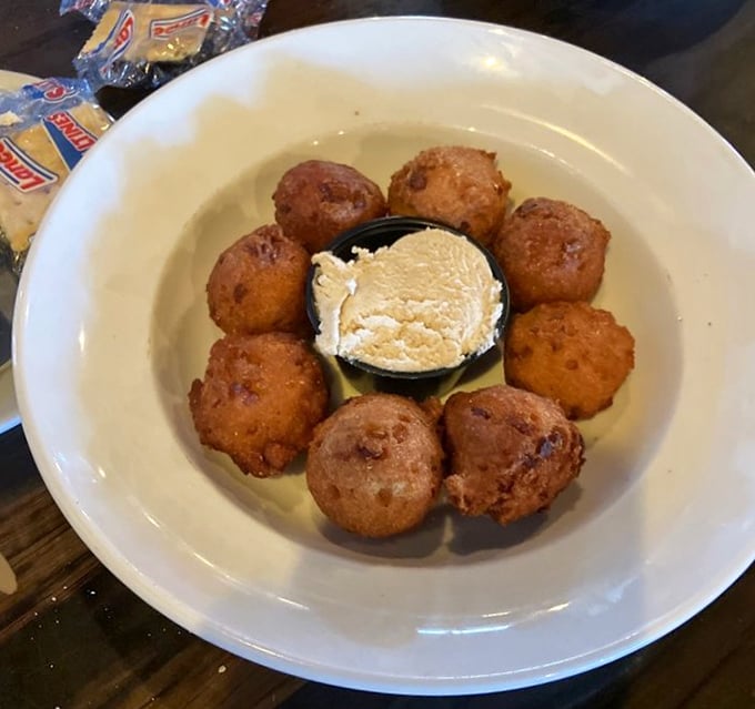 Hush puppies at Walt's are the supporting actors that steal the show – golden orbs of cornmeal joy that demand a starring role on your plate.