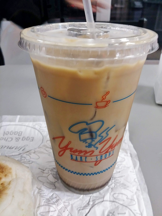 Iced coffee in a classic cup – the perfect sidekick for your donut adventure. Like Batman and Robin, if Robin were deliciously caffeinated.