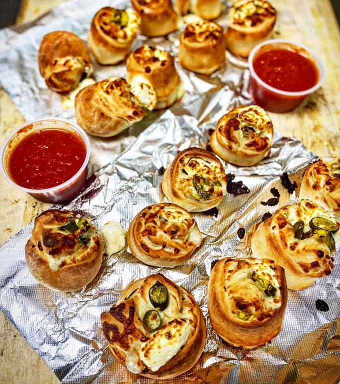 These jalapeño poppers look like they're having more fun than anyone at the party – golden, bubbly, and just waiting to surprise you.