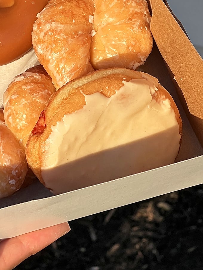 A cross-section revealing the donut's inner sanctum—where glaze meets dough in perfect harmony. This is structural integrity worth studying.