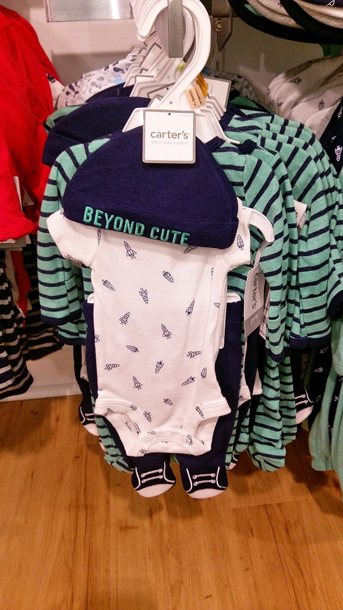 Beyond Cute isn't just on the hat—it's the entire baby section where resistance is futile and grandparents surrender their credit cards willingly. 