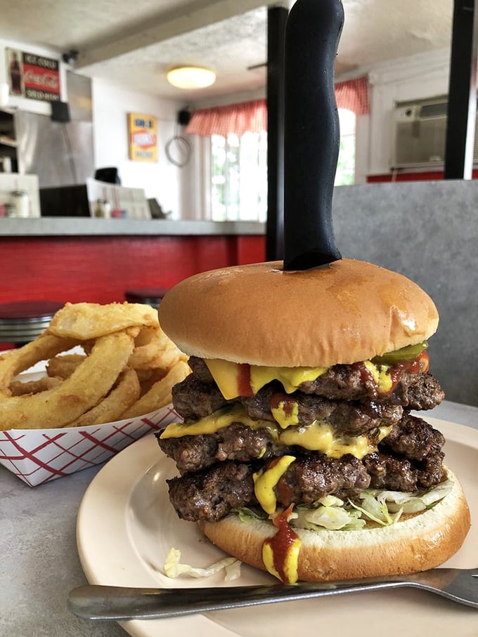 The Knife and Fork Burger isn't just named that as a suggestion—it's a four-patty declaration of war against sensible portion sizes.