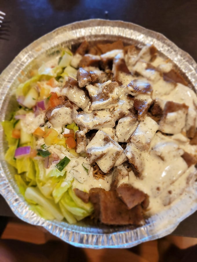 Tender chunks of lamb nestled on a bed of rice with fresh veggies—proof that Legends isn't just a one-trick chicken pony.