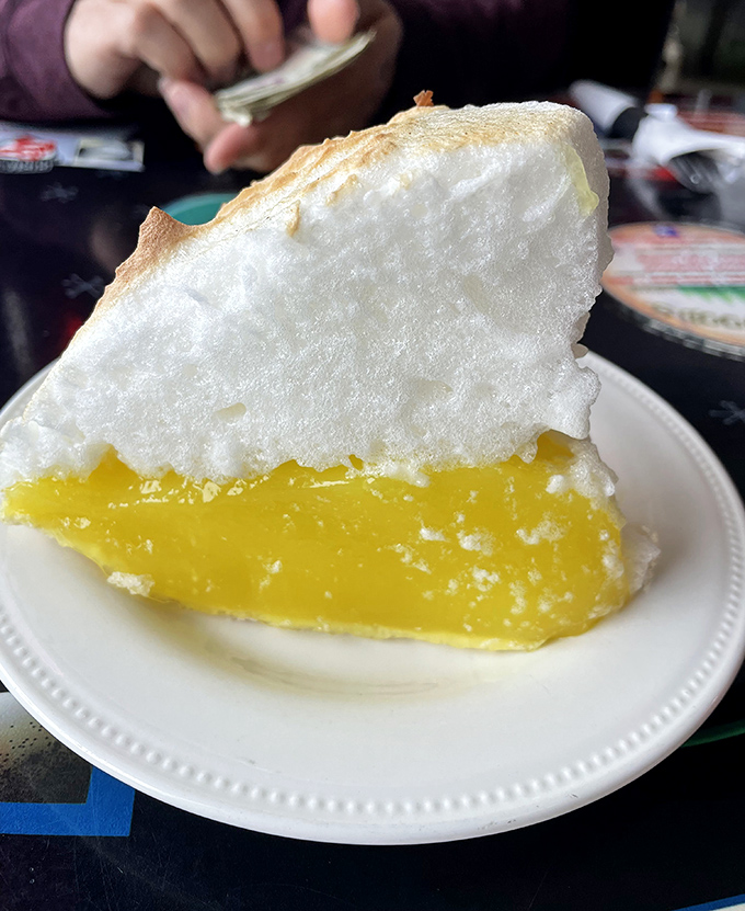 Lemon meringue pie with a mile-high cloud of sweet meringue floating above tangy lemon filling—dessert architecture at its finest.