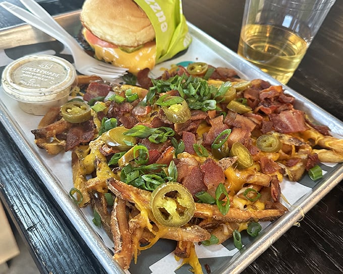 Loaded fries that require a game plan. The jalapeños, bacon, and scallions create a flavor symphony that Mozart would have appreciated.