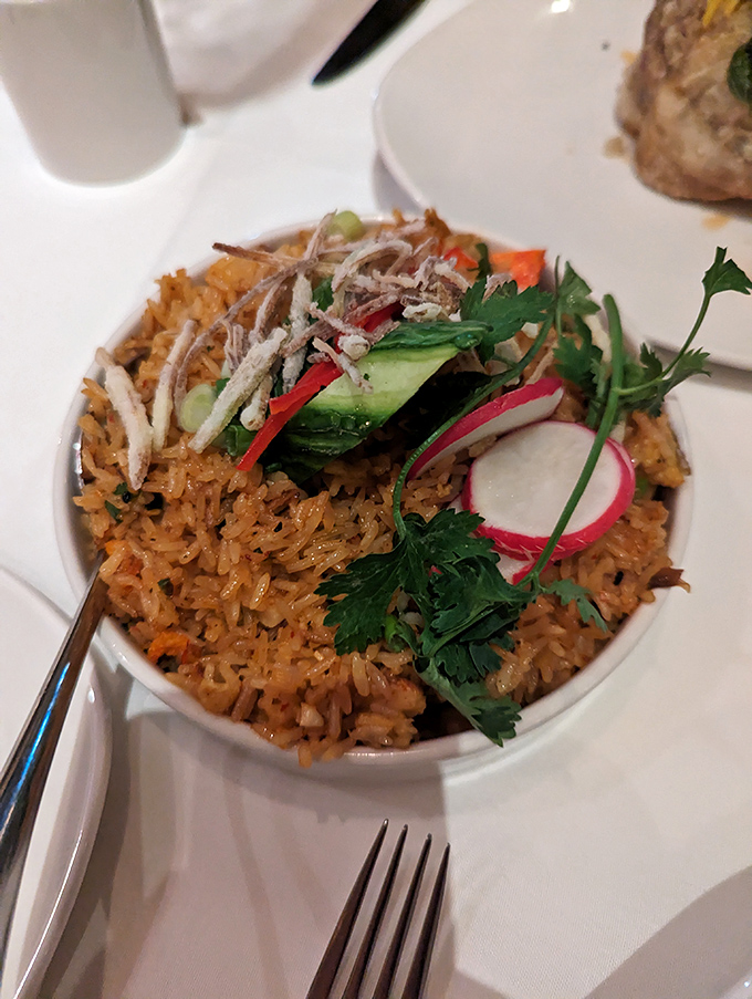This isn't just fried rice—it's a colorful celebration where lobster decided to crash the party and everyone's delighted by the surprise guest.