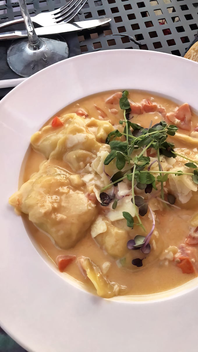 Lobster ravioli swimming in a sauce so good you'll want to request a straw. Microgreens add color, but that sauce is the real showstopper.