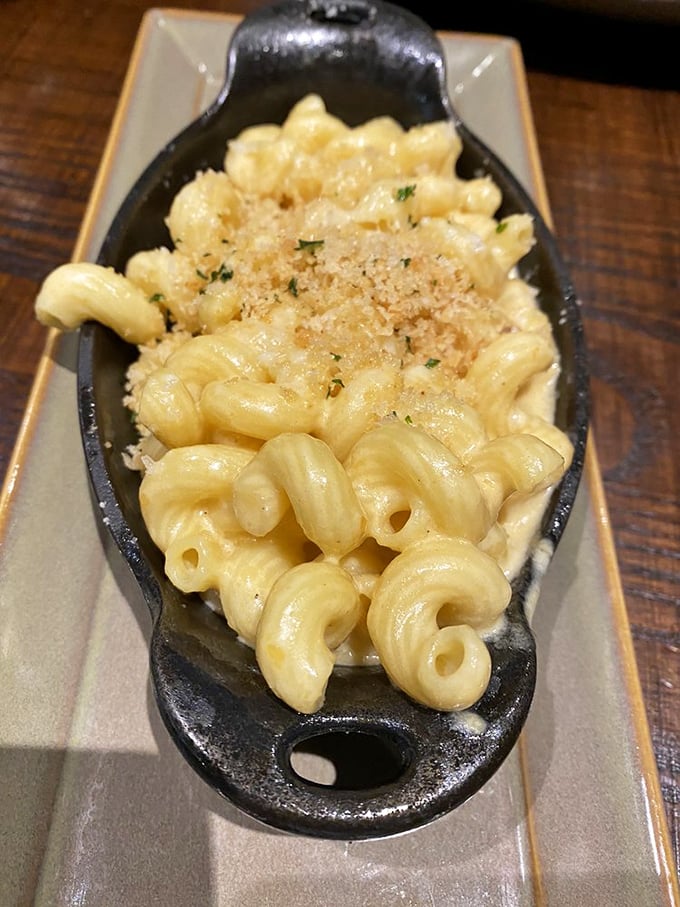 Mac and cheese served in a cast-iron skillet isn't just comfort food—it's therapy you can eat with a fork.