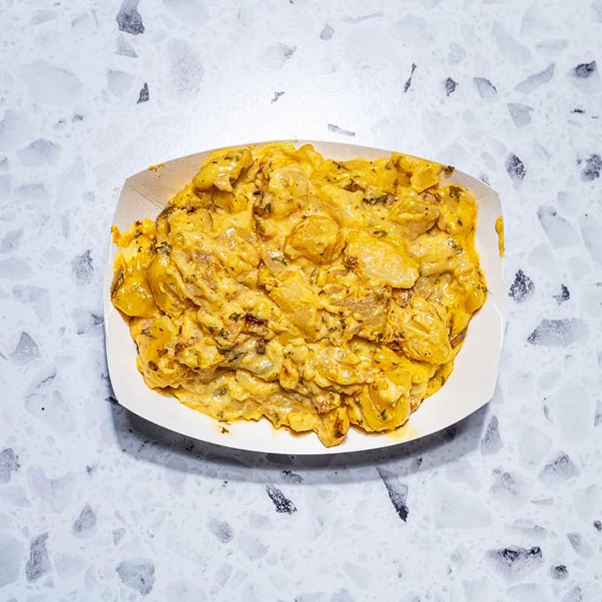 Mac and cheese that doesn't just comfort—it embraces you like an old friend who's really good at cooking and terrible at diets.