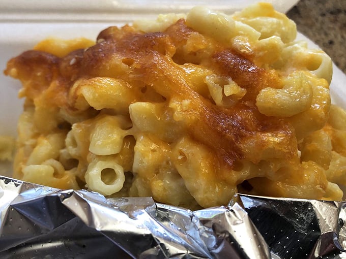 Mac and cheese so gloriously molten and comforting it could end family feuds or at least temporarily pause them until the last bite disappears.