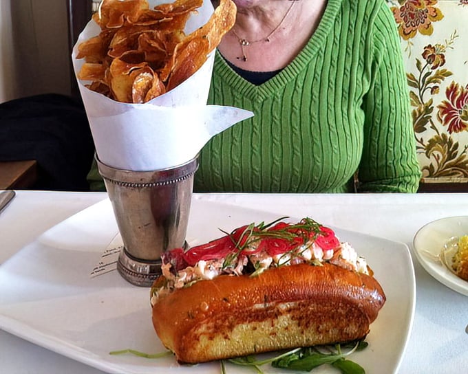 The Maine lobster roll arrives like a celebrity – plump, perfectly dressed, and accompanied by house-made chips that upstage every potato that came before them.
