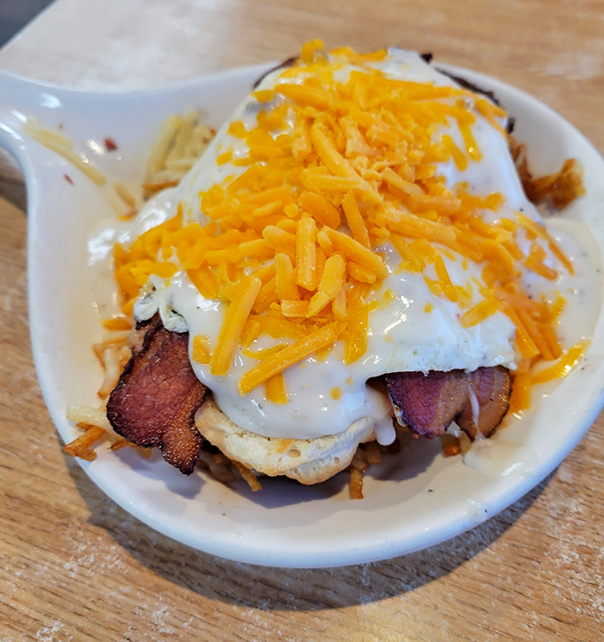 A skillet breakfast that laughs at your diet plans. That cheese-covered omelet nestled on hash browns is the morning equivalent of hitting the jackpot.