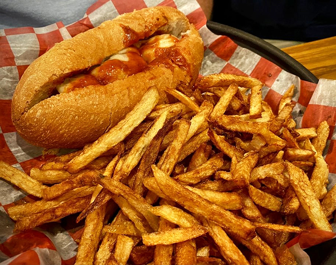 A meatball sandwich that doesn't need fancy packaging—just a checkered paper and your undivided attention. Those hand-cut fries aren't just sides; they're co-stars.