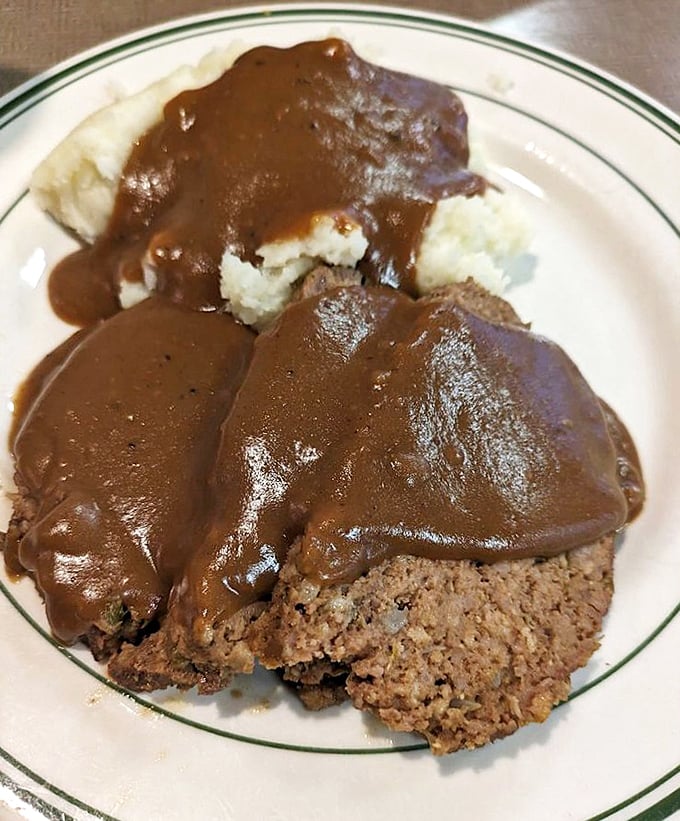 Meatloaf and gravy – the comfort food equivalent of a warm hug from someone who genuinely likes you, not just tolerates your existence.
