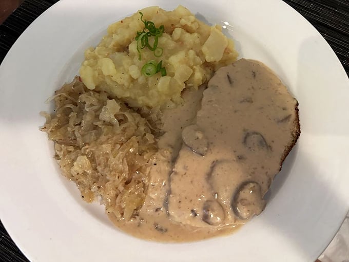 German meatloaf with sauerkraut – comfort food that hugs you from the inside. This plate says "Willkommen" better than any doormat ever could.