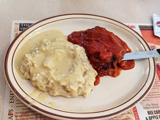 That's not just meatloaf – it's comfort food royalty served with mashed potatoes fit for a king.