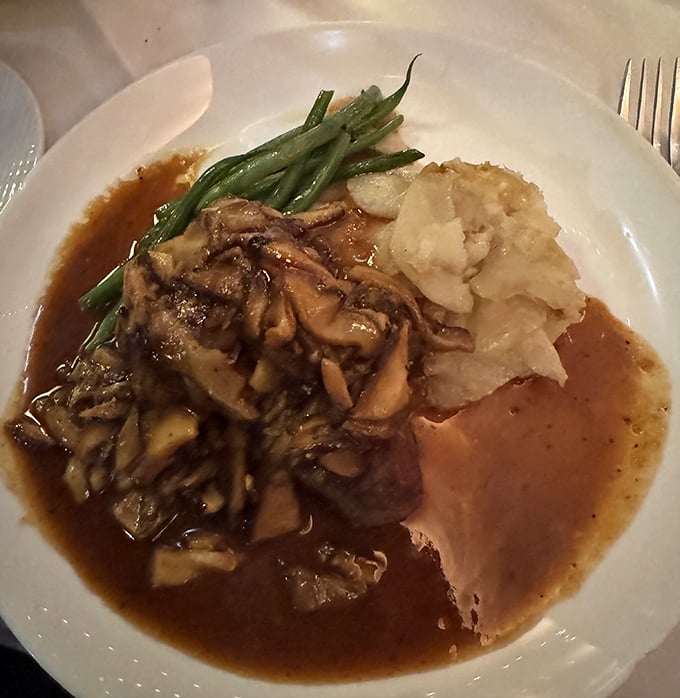 Veal with mushrooms and mashed potatoes—comfort food dressed in its Sunday best, ready for the culinary red carpet.
