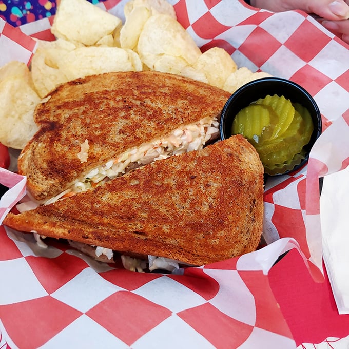 The sandwich melt that launched a thousand napkins. Perfectly grilled bread with that cheese pull that deserves its own slow-motion sequence.