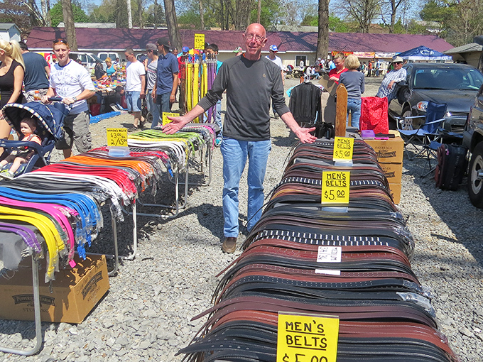The leather runway! A vendor proudly showcases his belt collection, where $5 can transform your pants from falling hazard to fashion statement.