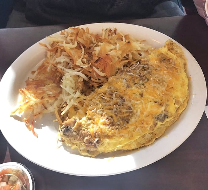 This omelet doesn't just contain cheese—it embraces it with the enthusiasm of a long-lost relative at a family reunion.