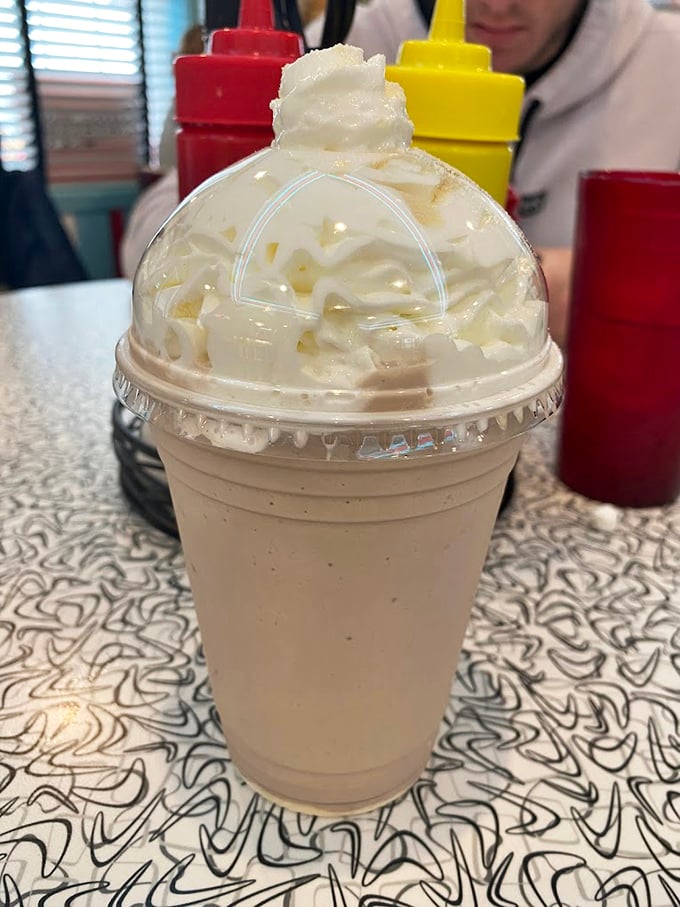 A milkshake so thick it laughs at straws. This isn't a drink—it's a commitment, a lifestyle choice, a creamy mountain of happiness.