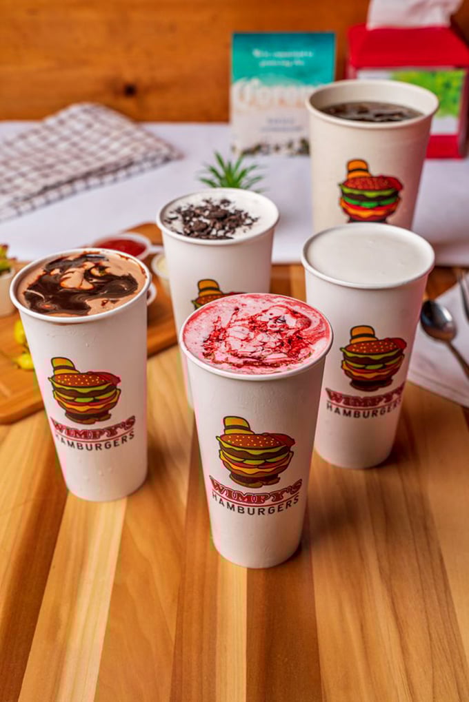 Milkshakes so thick and colorful they're practically dessert architecture – each one a different path to sweet, creamy bliss.