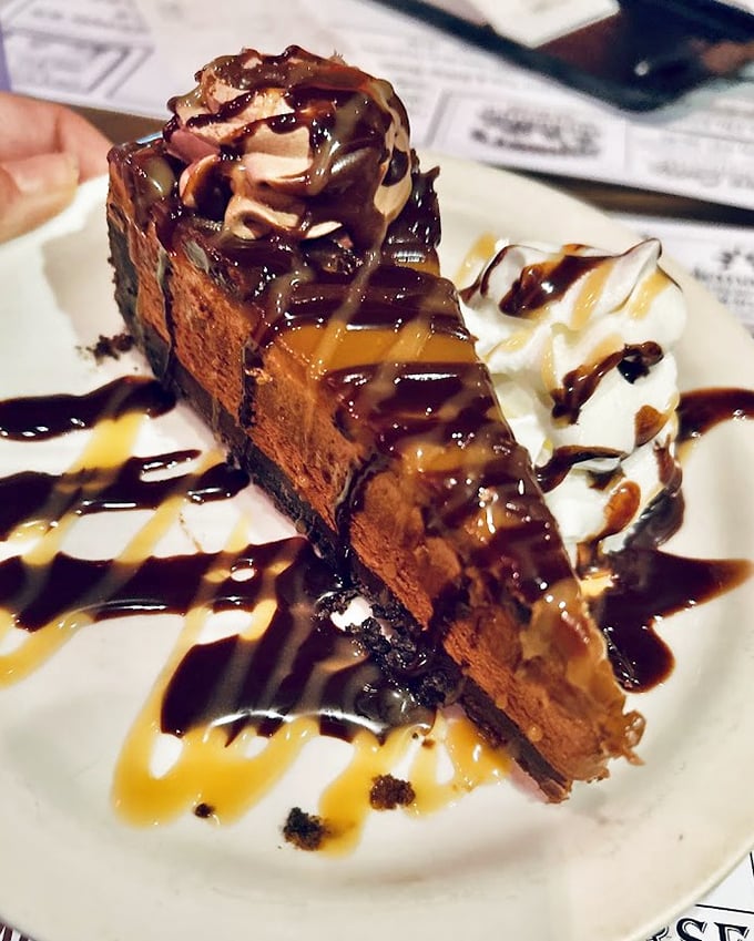 This isn't just dessert – it's architecture. Layers of chocolate, caramel, and whipped cream creating a skyline of sweetness that demands to be demolished.