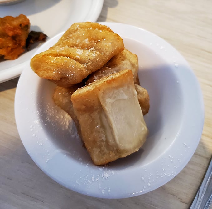 These golden-fried apple pies aren't dessert—they're edible time machines transporting you straight back to your grandmother's kitchen on Sunday afternoon.