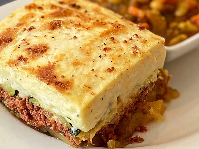 Moussaka: where comfort food meets culinary art. That golden béchamel crust is hiding layers of flavor that'll make you forget about lasagna forever.