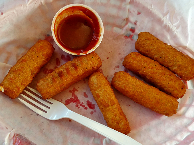 Golden, crispy, and ready for their close-up. These mozzarella sticks stretch dramatically with each bite—nature's perfect cheese delivery system.