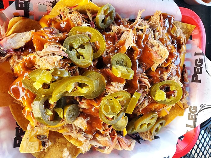 BBQ nachos that laugh in the face of ballpark versions—each jalapeño-topped bite a reminder that sharing is highly overrated.