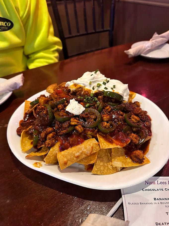 Nachos that require a strategy to eat—like chess, but delicious. Every chip is a vehicle for maximum flavor delivery.