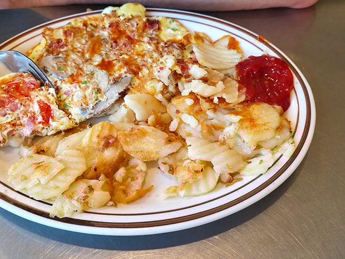 An omelet that's seen the inside of a properly heated pan – with home fries that deserve their own fan club.