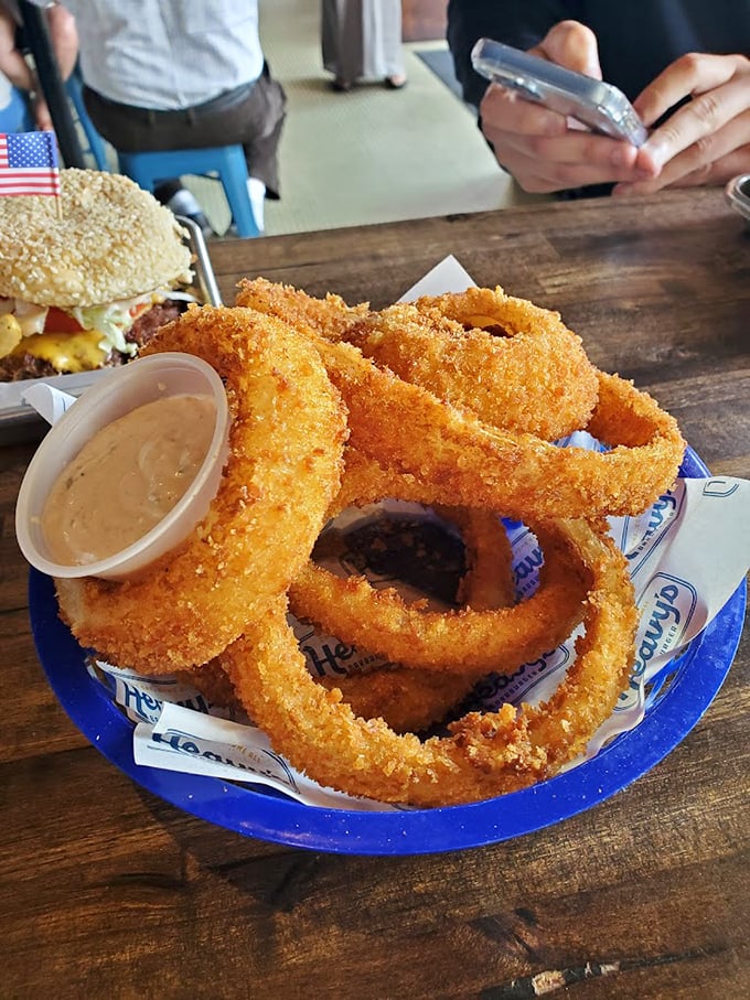 Onion rings with the perfect crunch-to-squish ratio. That dipping sauce isn't just condiment—it's a supporting character in this delicious drama.