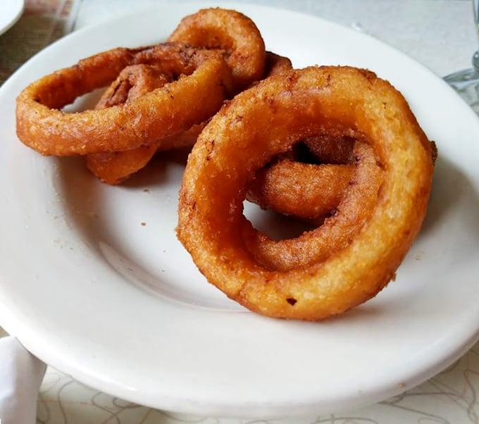 Onion rings with that perfect crunch-to-softness ratio—the kind that make you wonder why we don't consider them a legitimate breakfast food.
