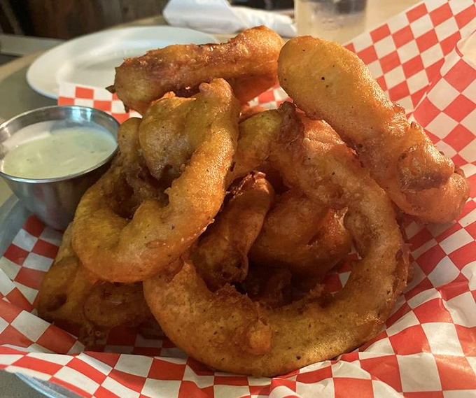 Golden-battered glory: These onion rings aren't just side dishes—they're crispy halos of happiness that deserve their own spotlight and standing ovation.