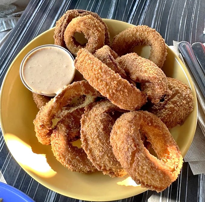 These onion rings aren't just side characters – they're the main event, with a golden crunch that deserves its own standing ovation.
