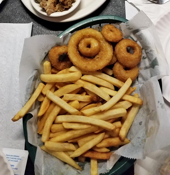 Golden onion rings and perfectly crisp fries—the supporting actors that sometimes steal the show from the BBQ headliners.