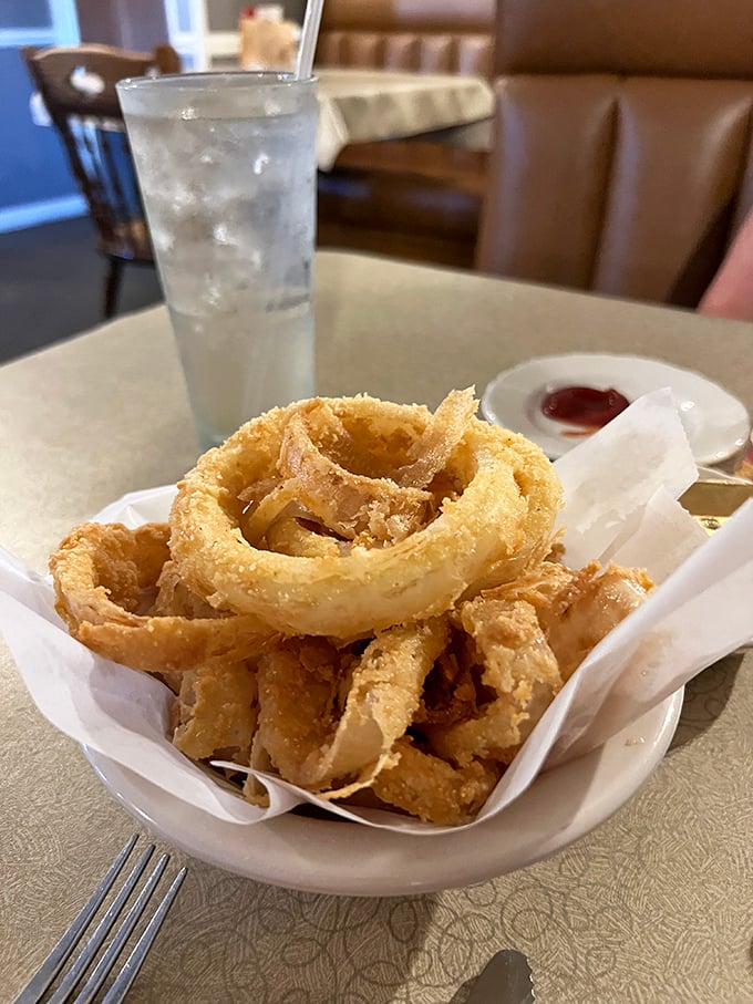 These aren't just onion rings—they're golden halos of crispy perfection that make you wonder why you'd ever eat vegetables any other way.