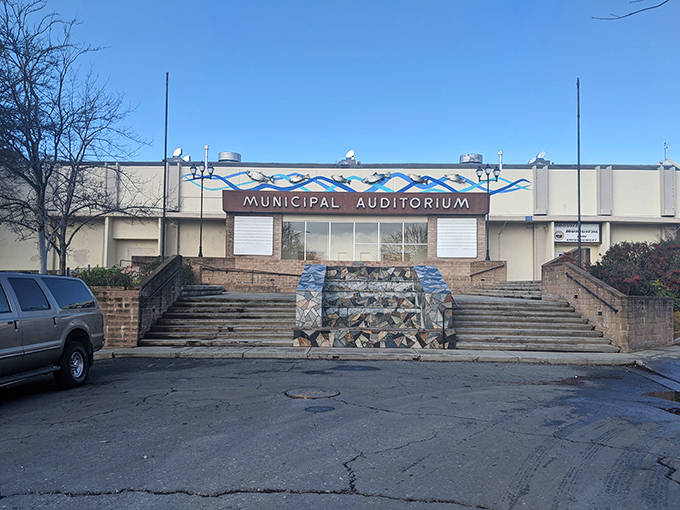The Municipal Auditorium stands ready for community gatherings, its mid-century architecture a reminder of when public spaces were built to impress, not just function.